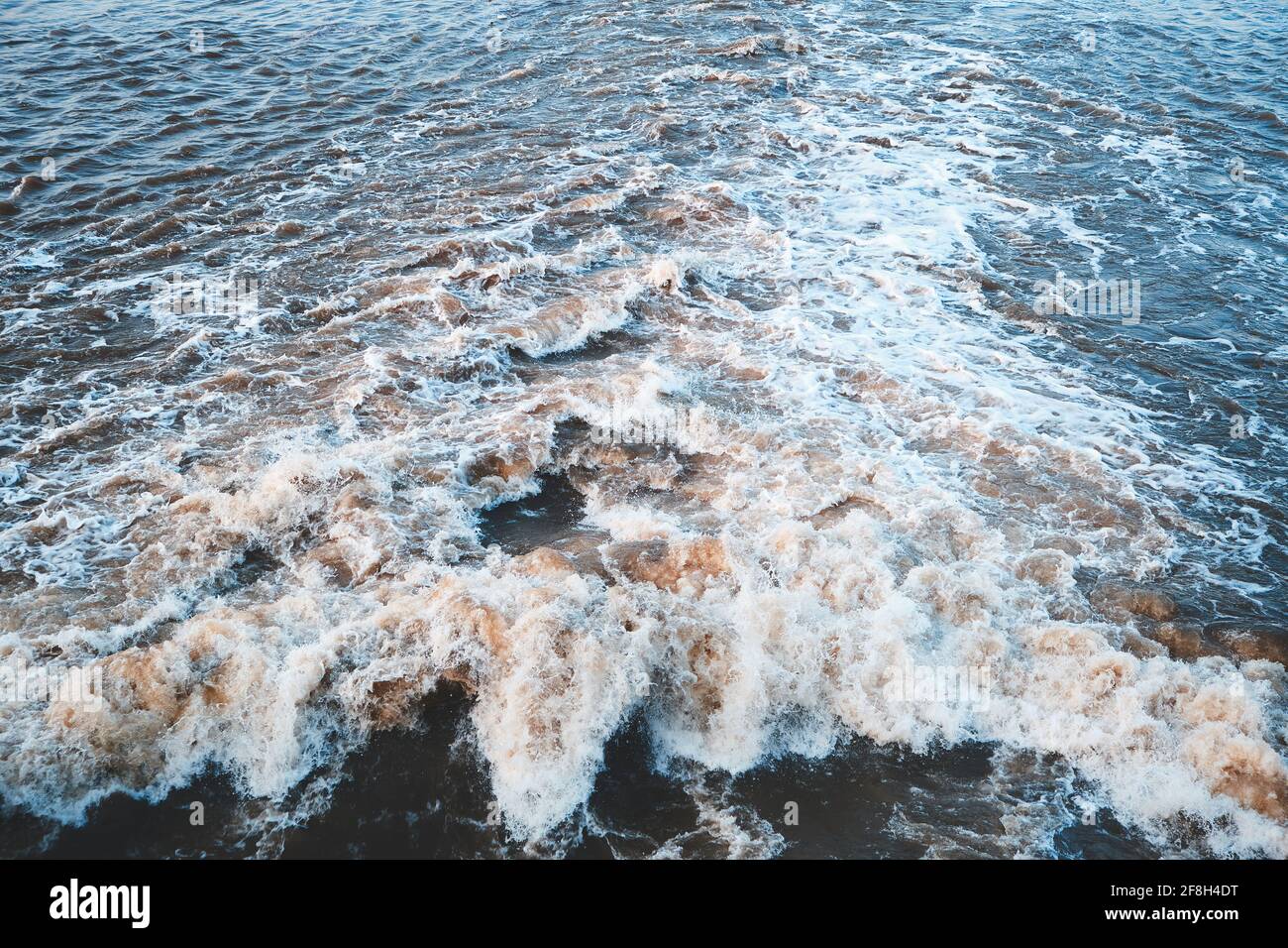 Stream of dirty meltwater on sunny spring day Stock Photo - Alamy