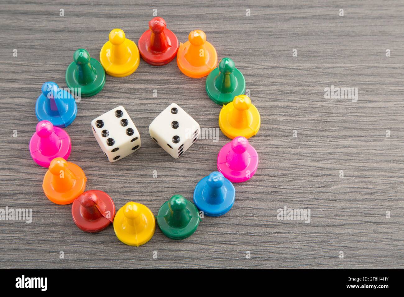 colorful wooden game pieces with dices Stock Photo - Alamy