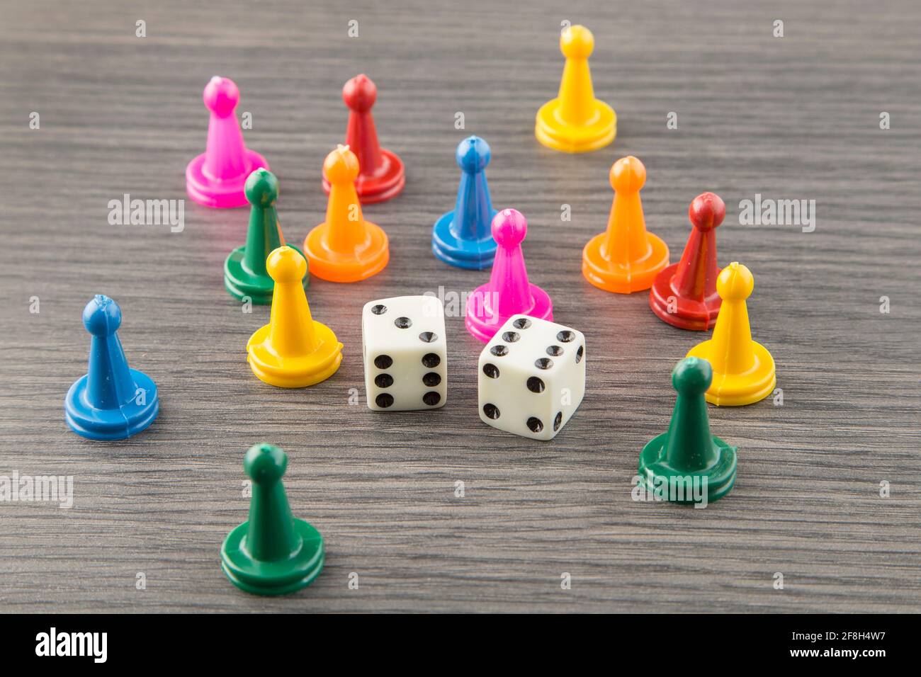 colorful wooden game pieces with dices Stock Photo - Alamy