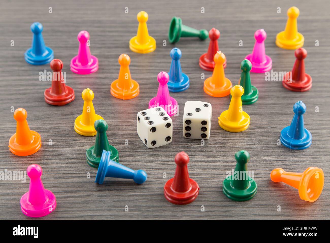 colorful wooden game pieces with dices Stock Photo - Alamy