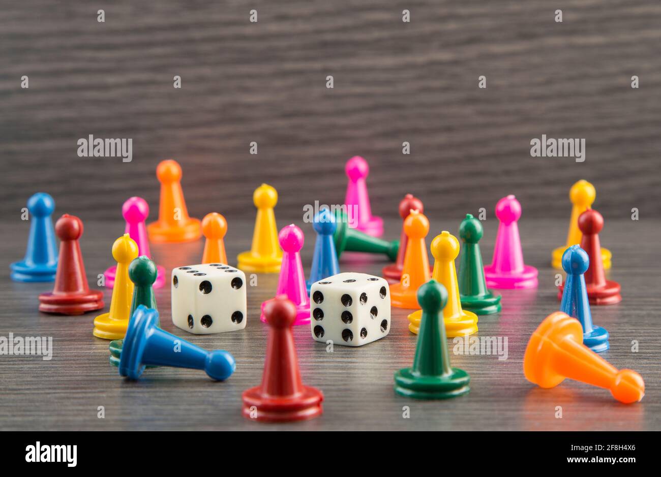 colorful wooden game pieces with dices Stock Photo - Alamy