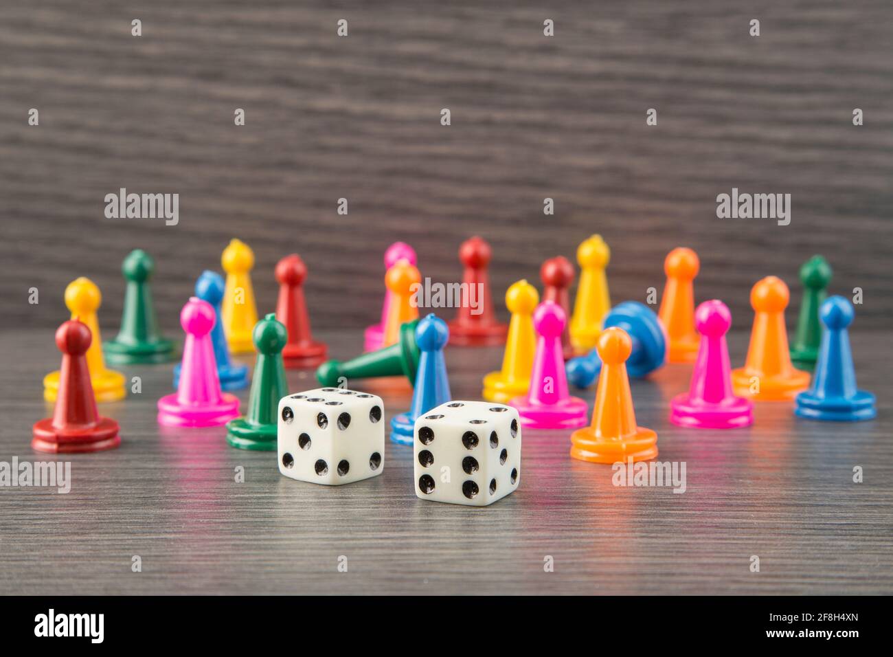 colorful wooden game pieces with dices Stock Photo - Alamy