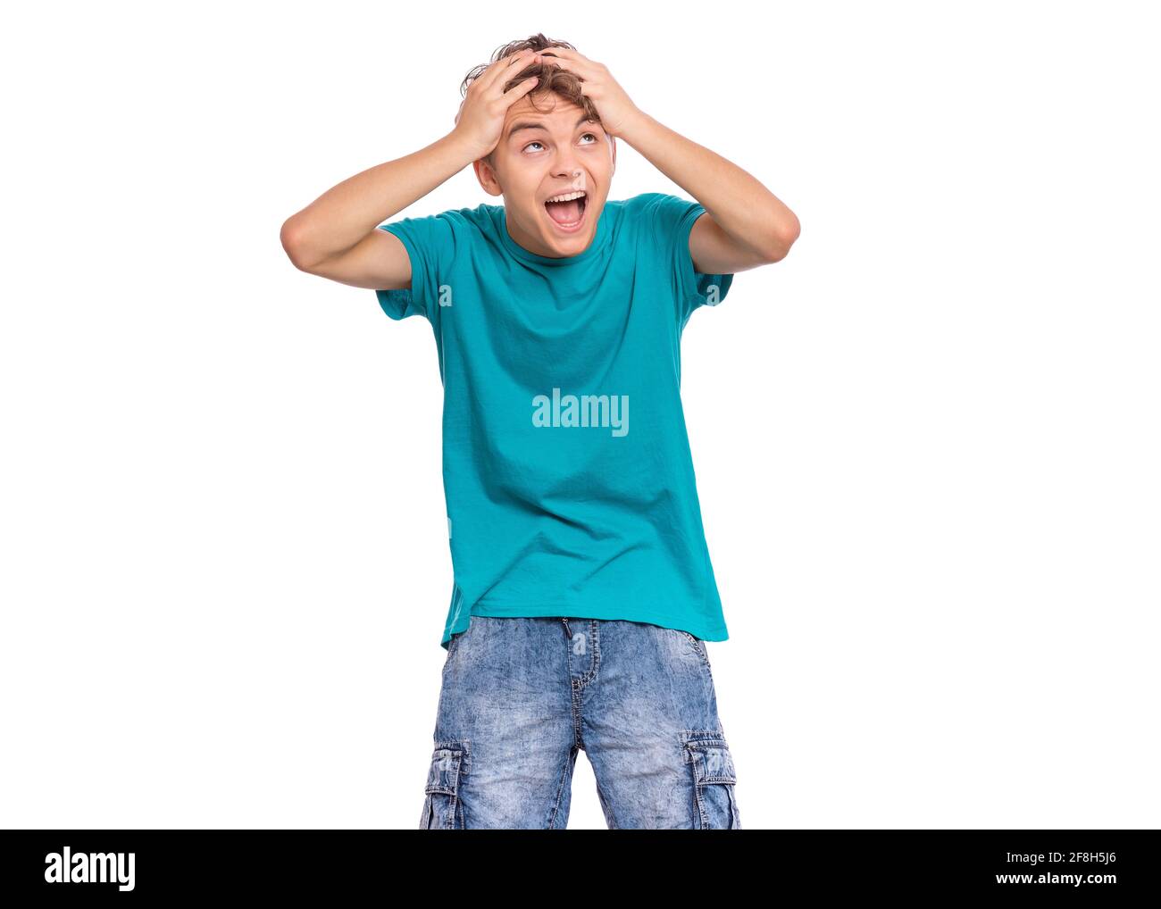 Emotional portrait of scared boy teenager, isolated on white background ...