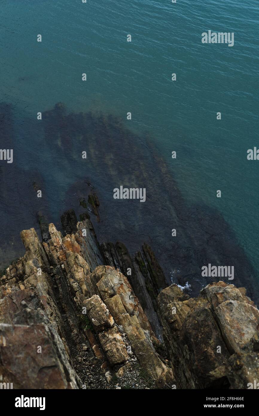 View from a high cliff to the blue turquoise clear sea and coral reefs ...