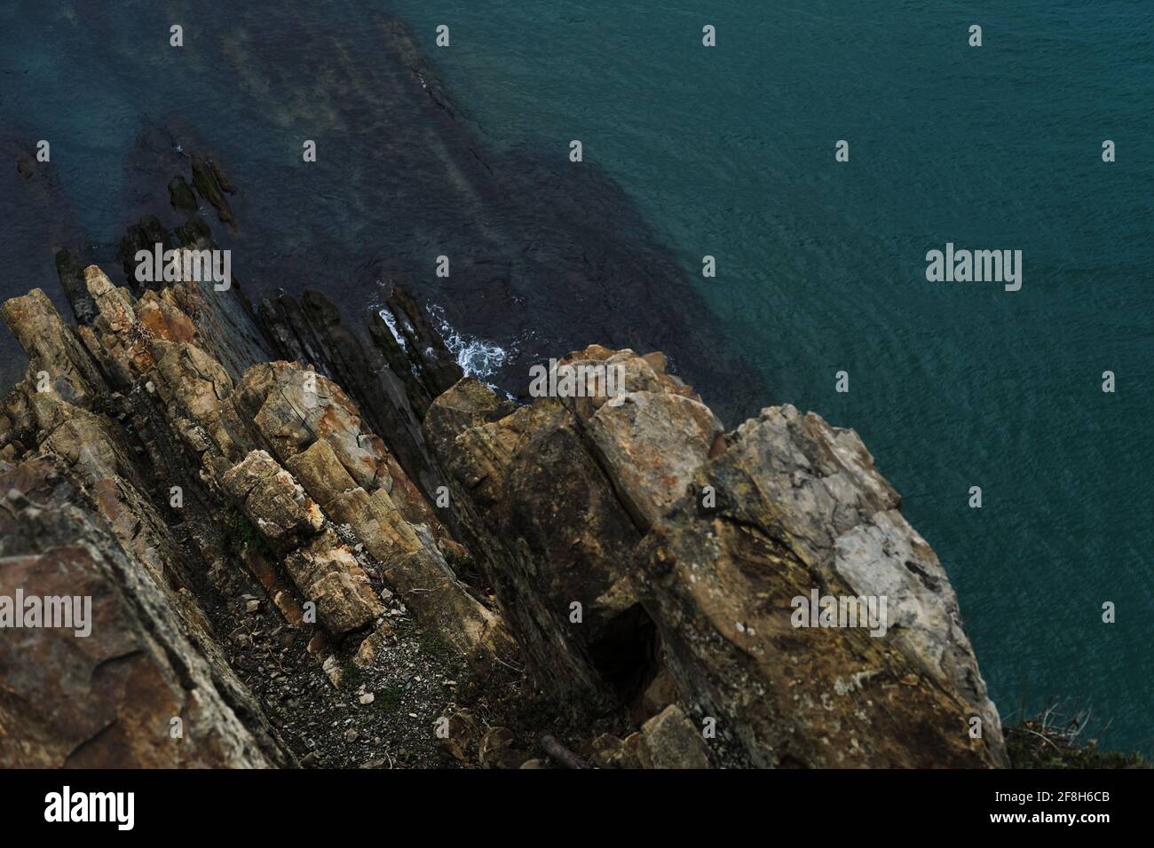 View from a high cliff to the blue turquoise clear sea and coral reefs ...