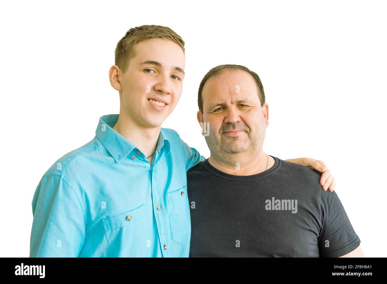 Father and son, standing with their arms around each other and looking ...