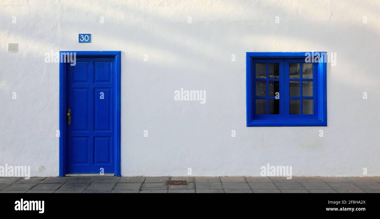 typical architecture with whitewashed walls and blue windows, Arrecife ...
