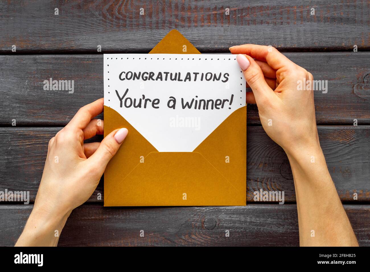 Congratulations award concept -You are a winner card in golden envelope ...