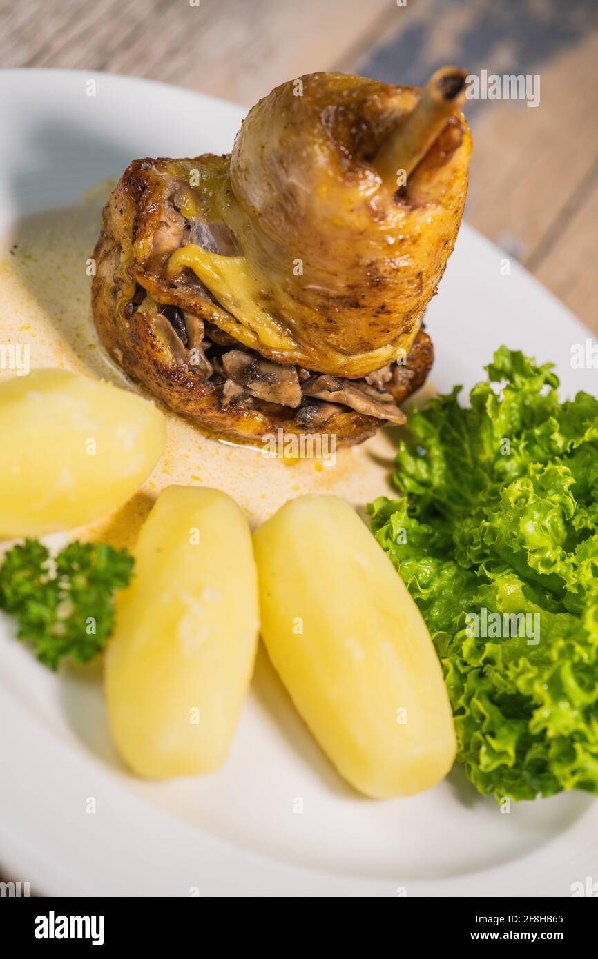 Chicken gigolette recipe with mushrooms accompanied by turned potatoes ...