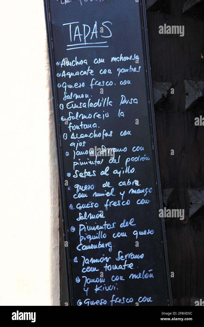 Spain, Andalusia, Granada, Menu at a restaurant in the old city Stock ...