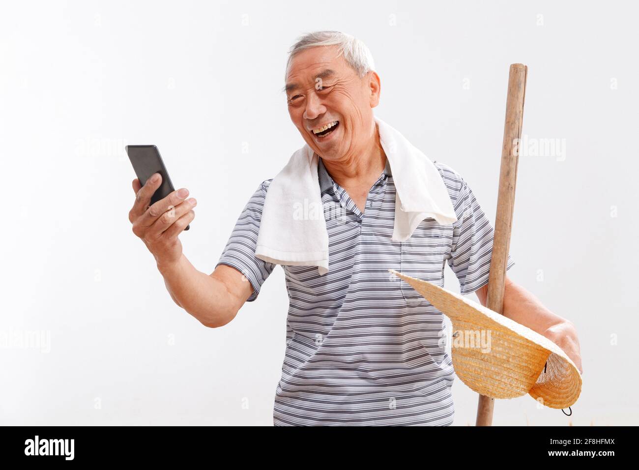 Farmers with mobile phone Stock Photo - Alamy