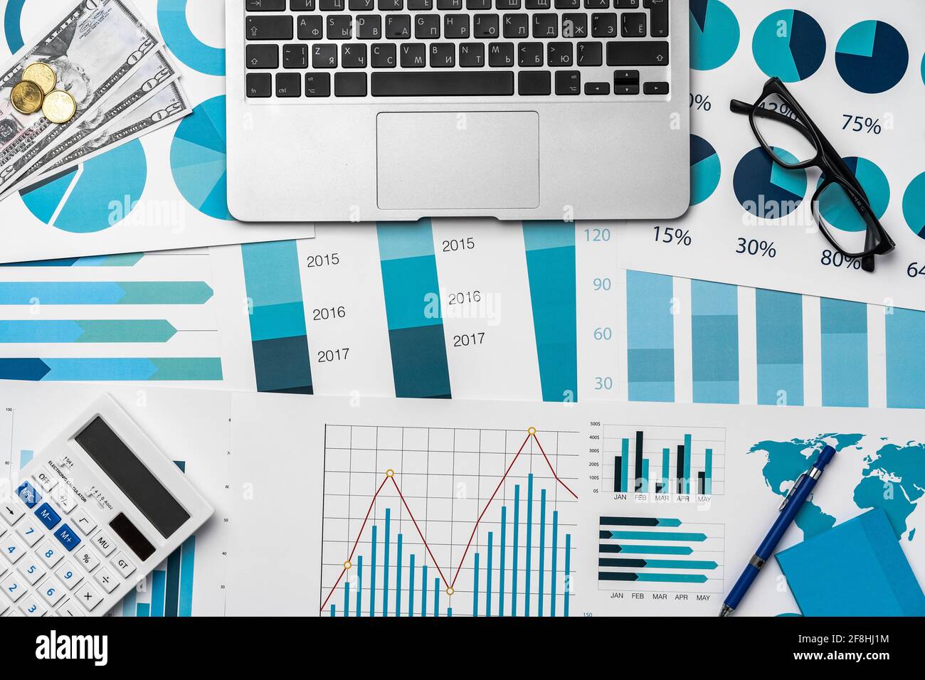 Financial paper with charts and diagrams on gray table Stock Photo - Alamy