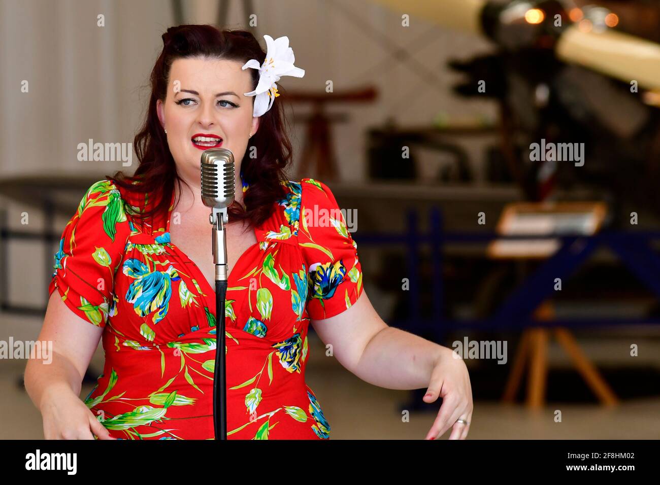 Lady Singer in red dress Stock Photo - Alamy