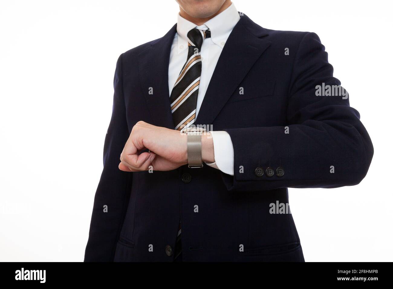 Business person watching time on a wristwatch Stock Photo - Alamy