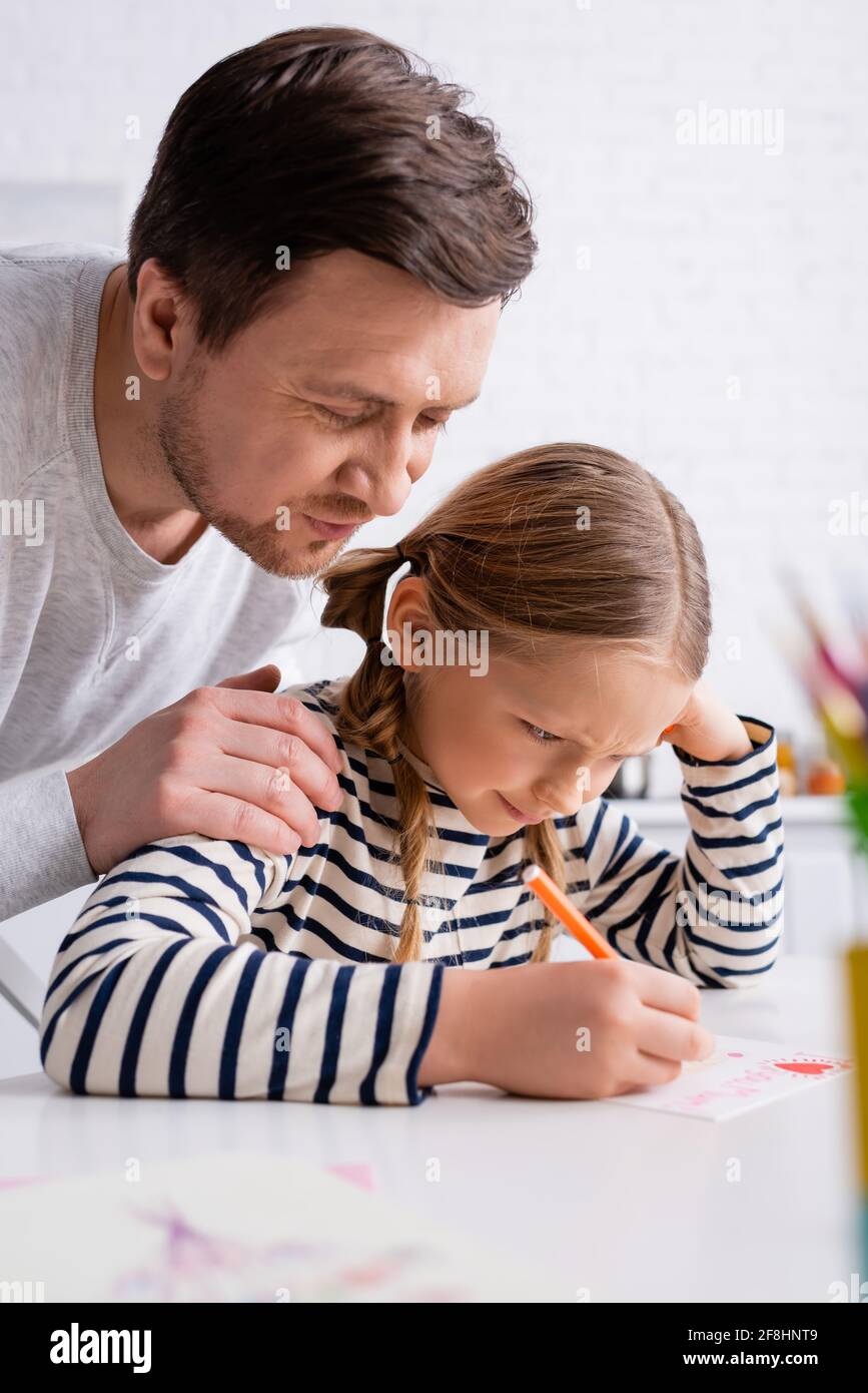 Child touching shoulder hi-res stock photography and images - Alamy