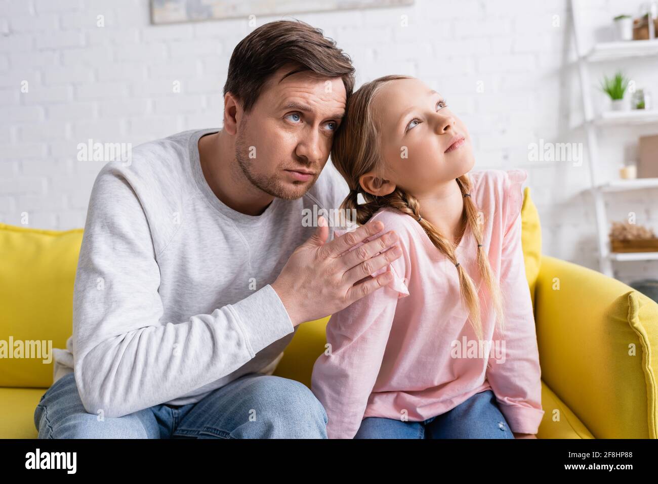 Kid touching shoulder hi-res stock photography and images - Alamy