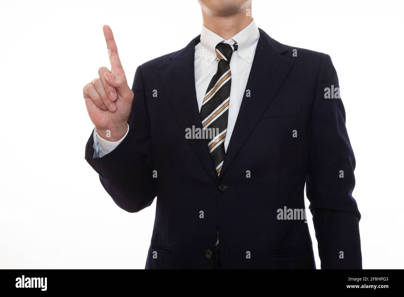A man in a suit explaining the points with a gesture of raising the ...