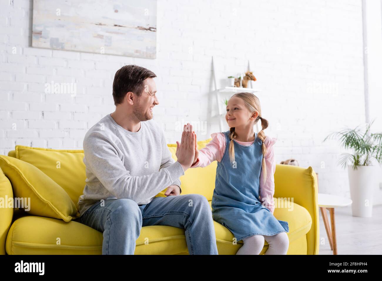 Child adult high five hi-res stock photography and images - Alamy