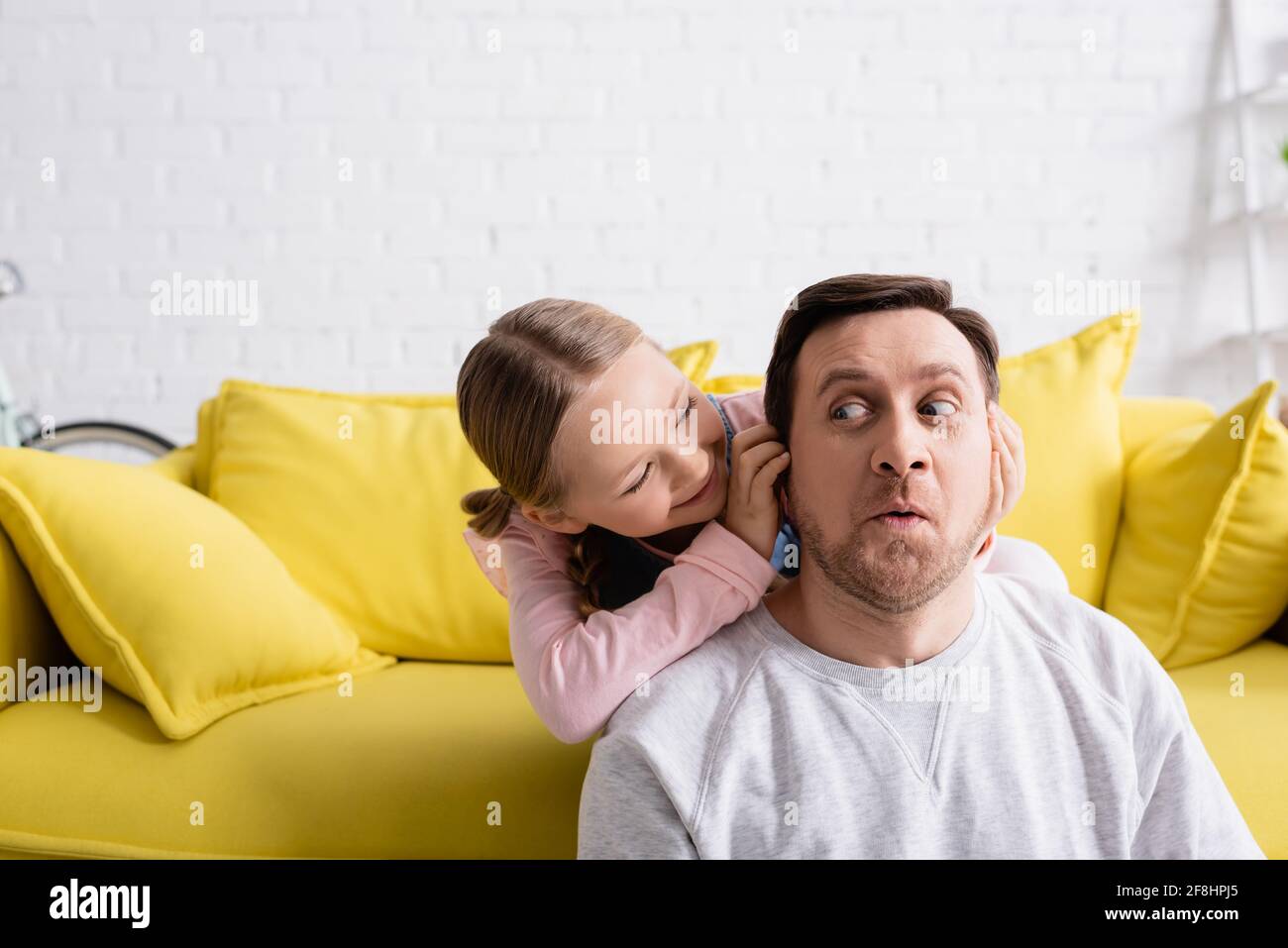 Child plugging ears hi-res stock photography and images - Alamy