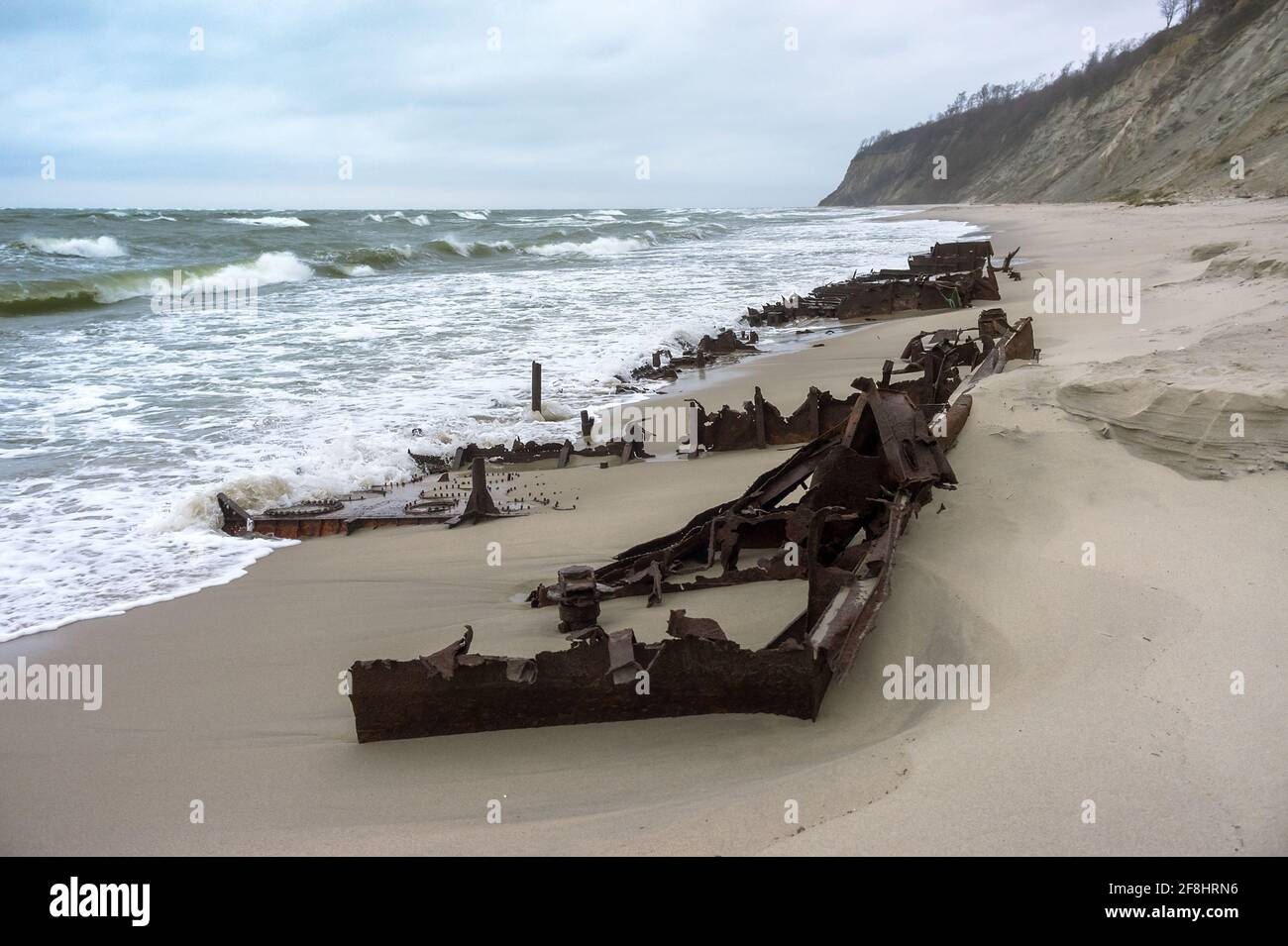 The rusted wreckage of an old ship. The remains of a seagoing vessel on ...