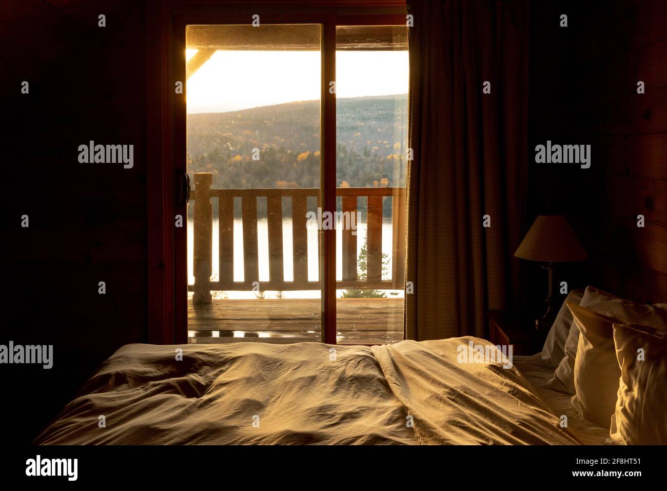 view a balcony on a sunset from the inside of a bedroom Stock Photo - Alamy
