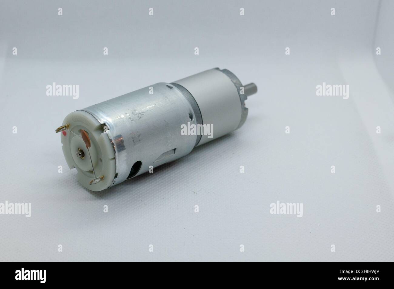 DC motor isolated on a white background Stock Photo - Alamy