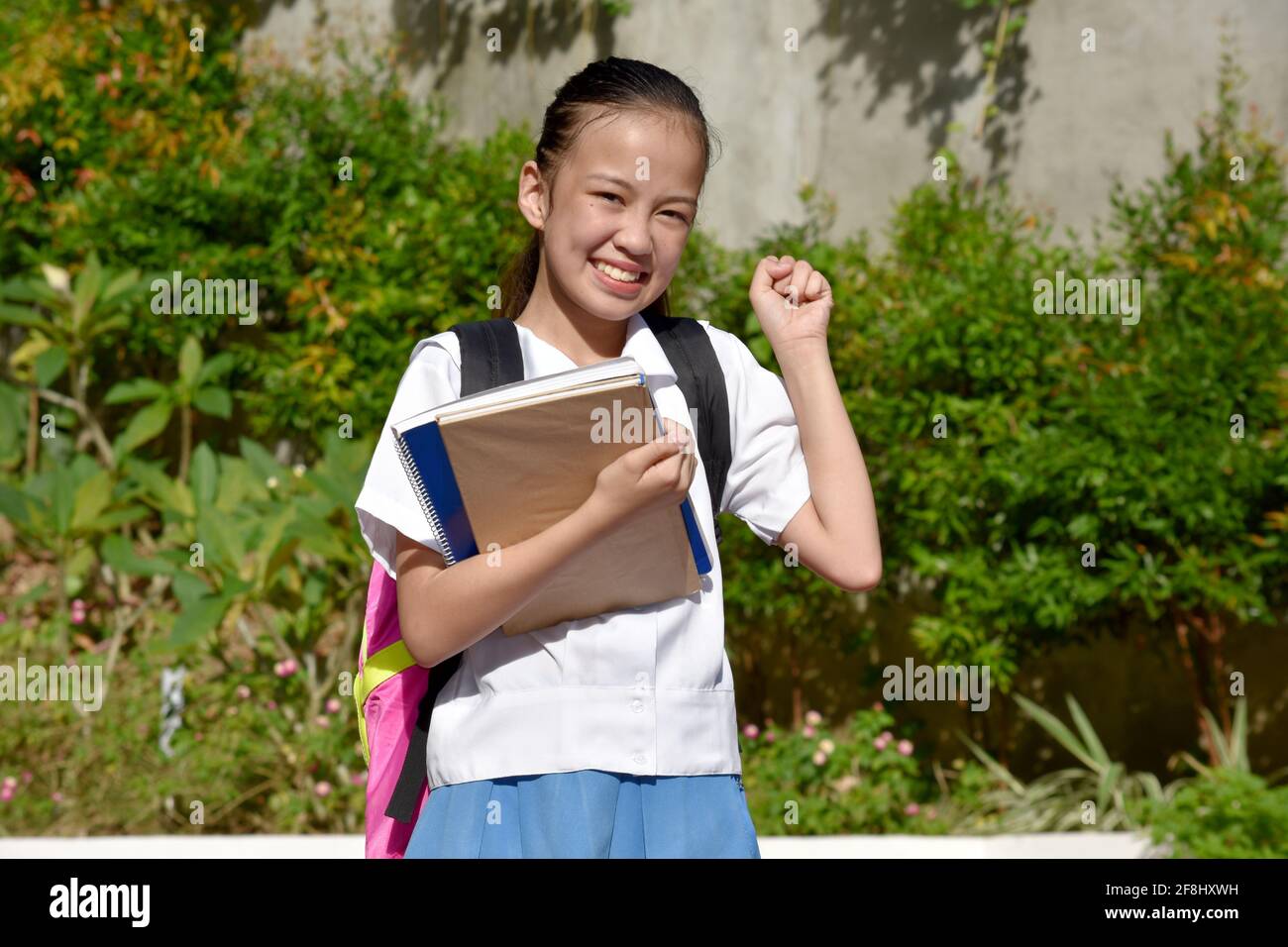 Successful Filipina Girl Student With School Books Stock Photo - Alamy
