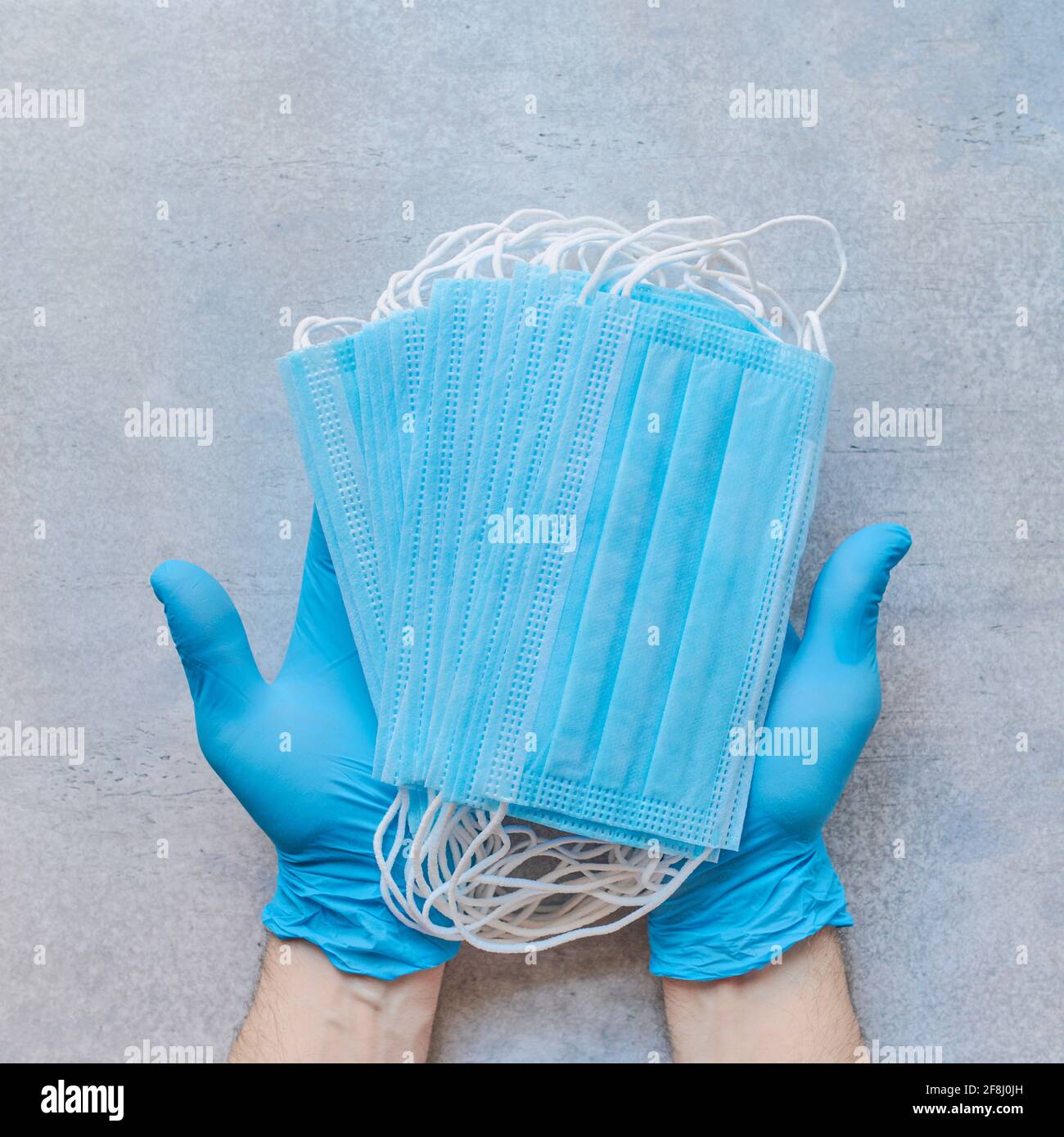 Hand held masks hi-res stock photography and images - Alamy