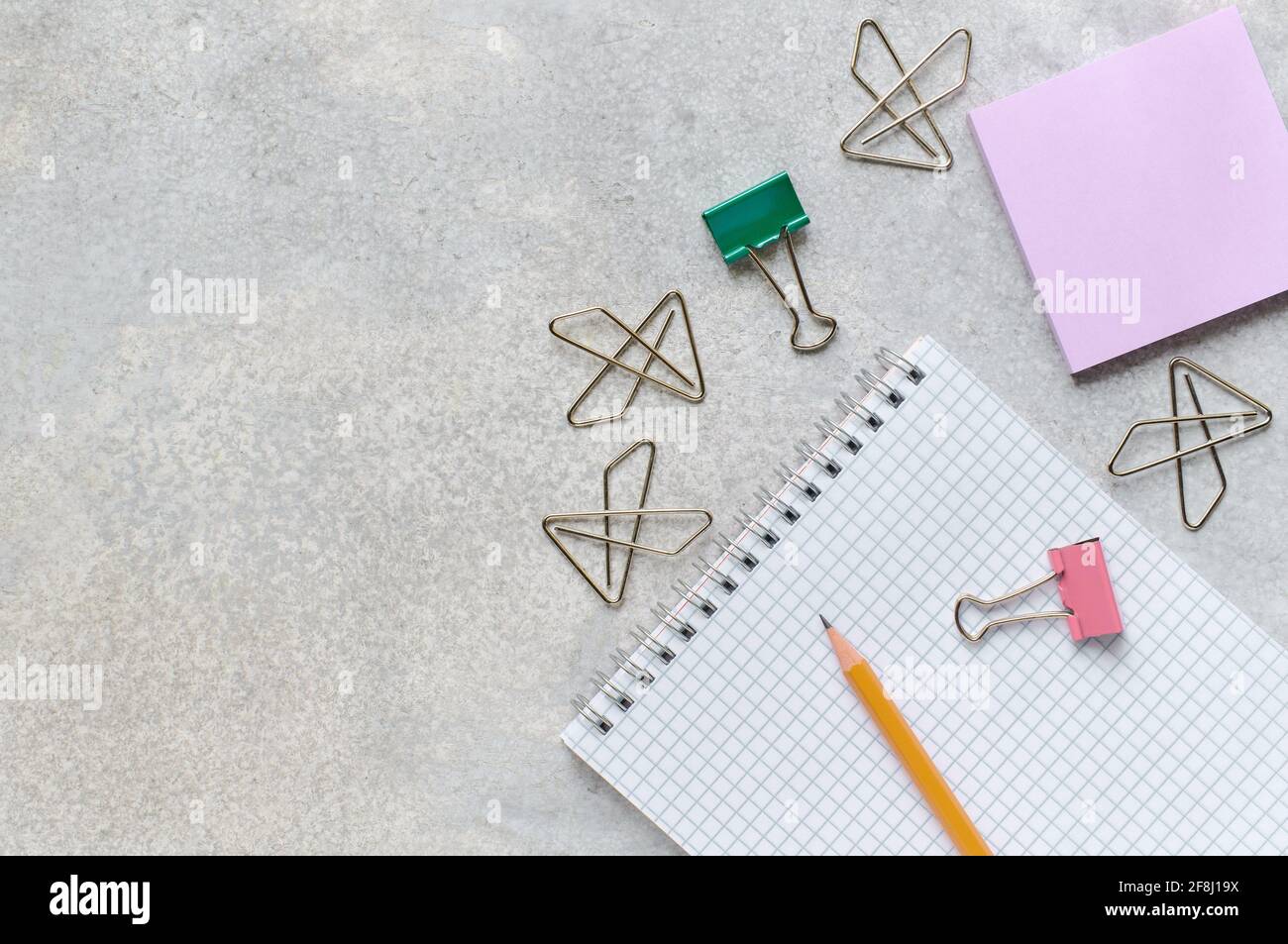 Office accessories, notebook, pencil, clerical staple, clips and sticky ...