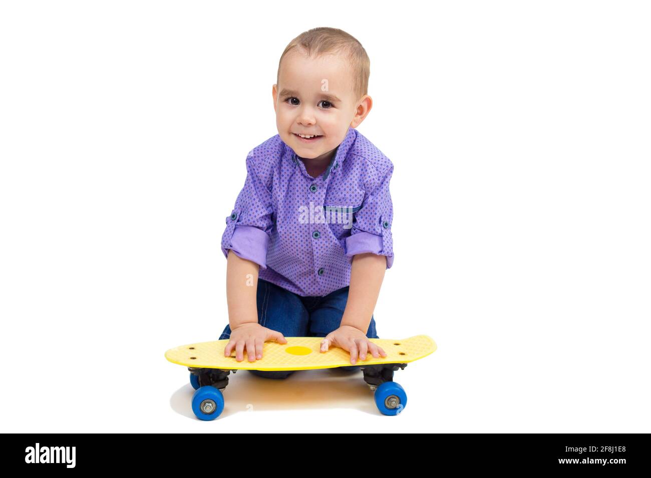 Child playing with roller board young skateboarder Stock Photo - Alamy