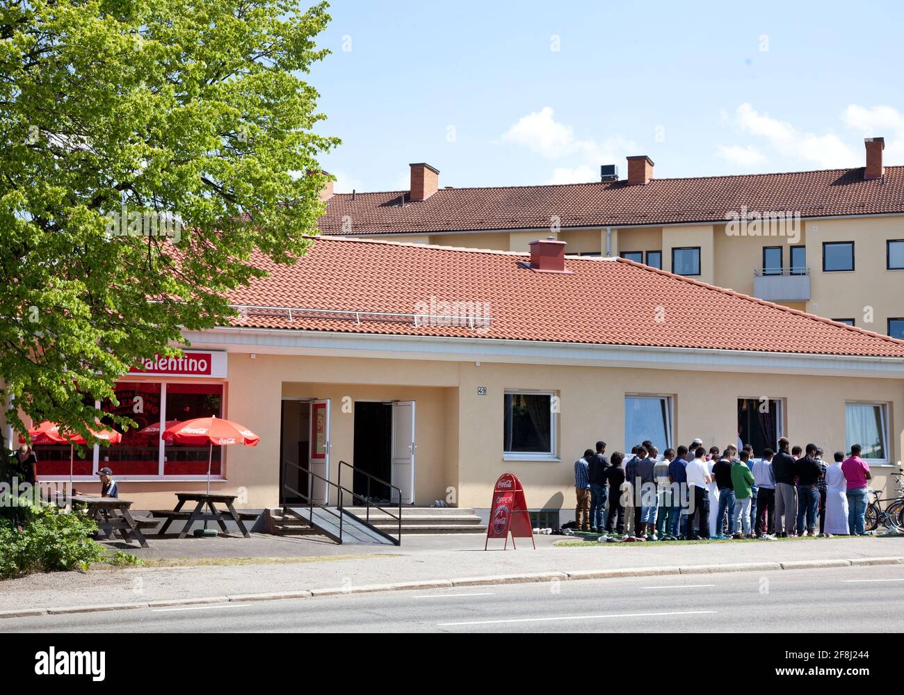 Prayer along a street in a city Stock Photo - Alamy
