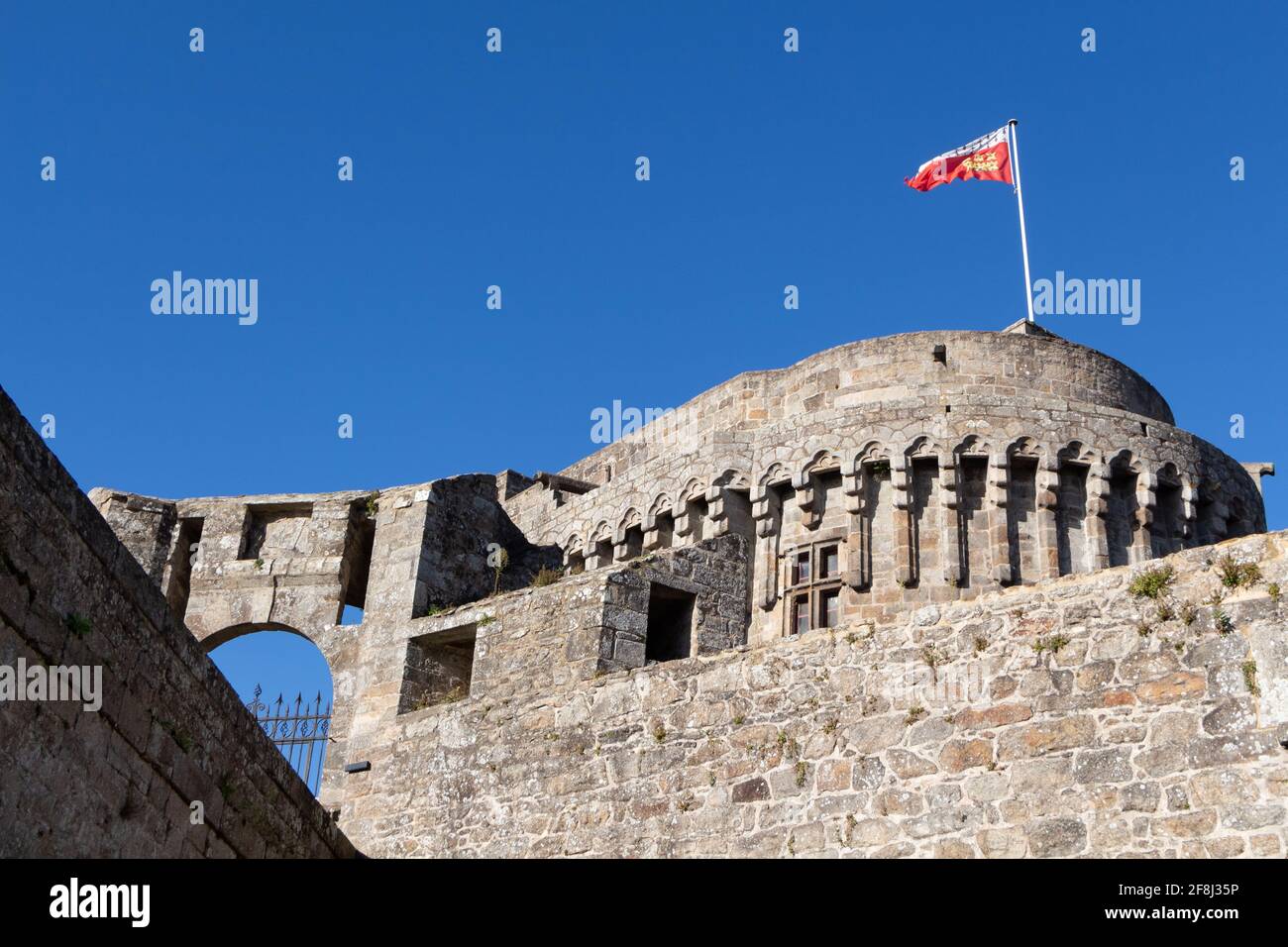 Castle of Dinan with a flag on the dungeon Stock Photo - Alamy