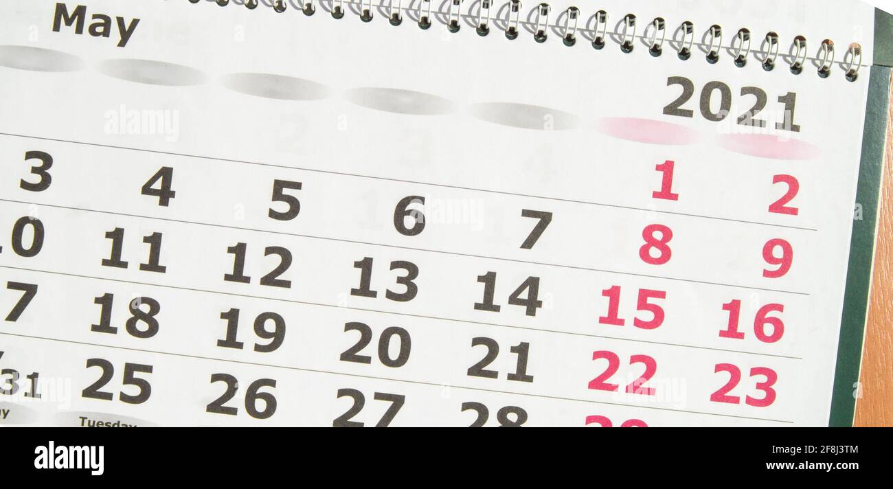 Top view of a large wall calendar for May 2021, the calendar sheets are ...