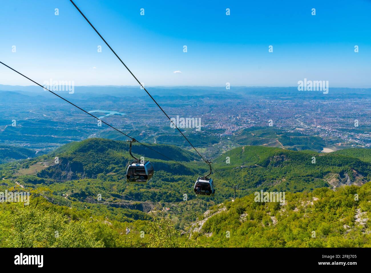 TIRANA, ALBANIA, SEPTEMBER 29, 2019: Gondola lift reaching stop at ...