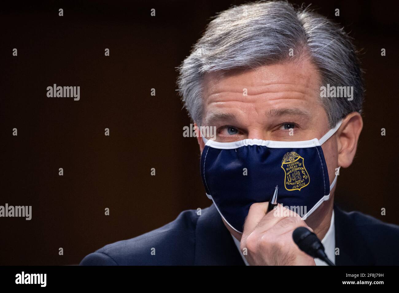 FBI Director Christopher Wray testifies during a Senate Select ...