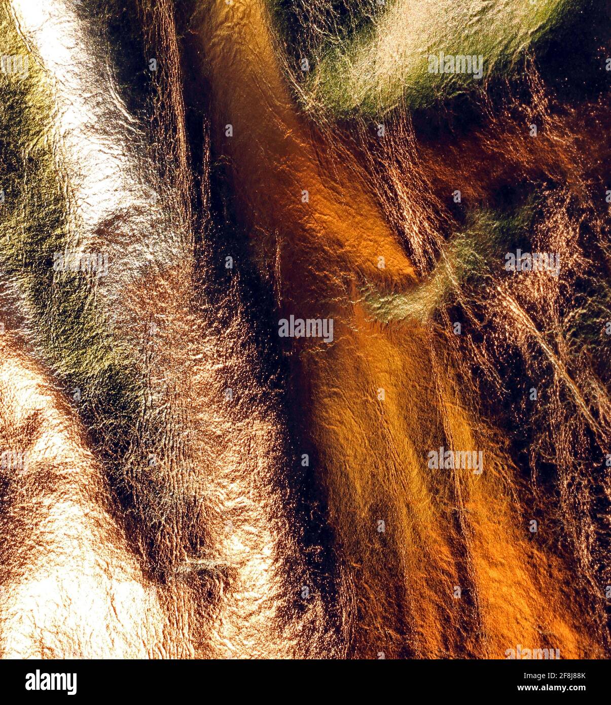 leather background with golden color very bright Stock Photo - Alamy