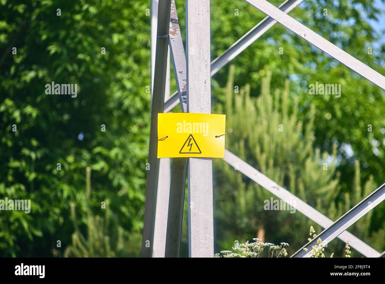 yellow signboard danger on an iron electric pole Stock Photo - Alamy
