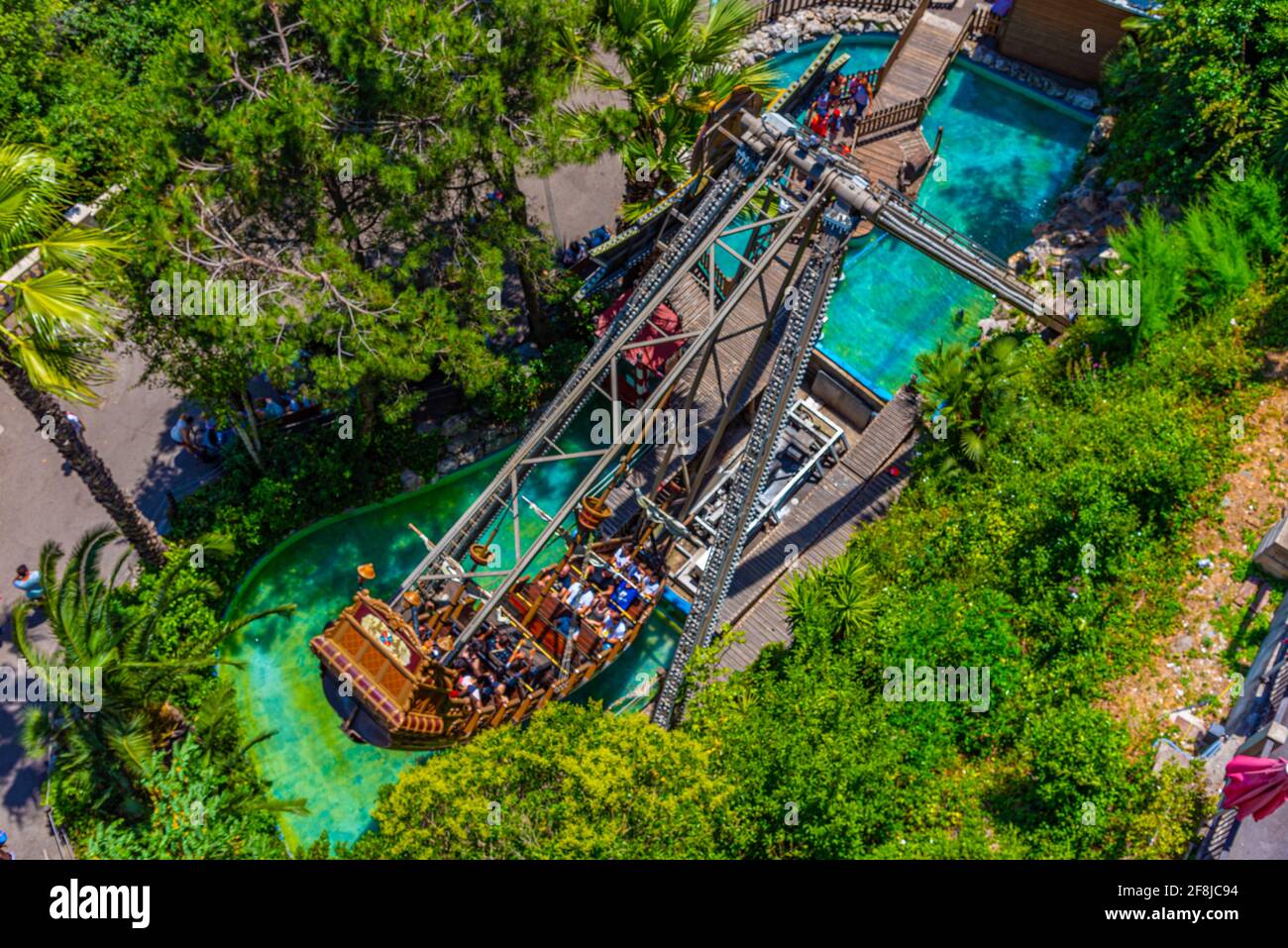BARCELONA, SPAIN, JUNE 29, 2019: People are taking a ride on a swinging ...