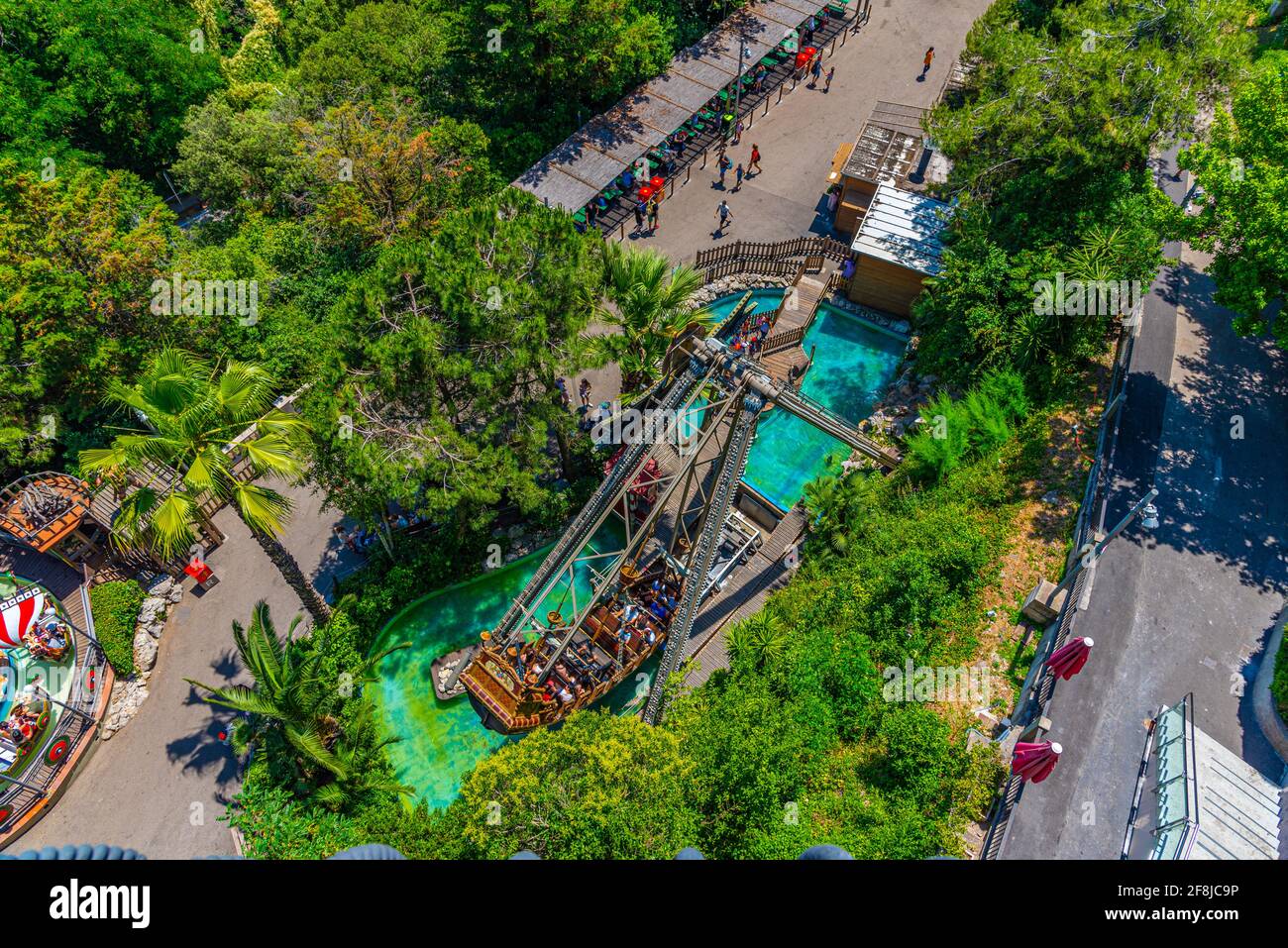 BARCELONA, SPAIN, JUNE 29, 2019: People are taking a ride on a swinging ...
