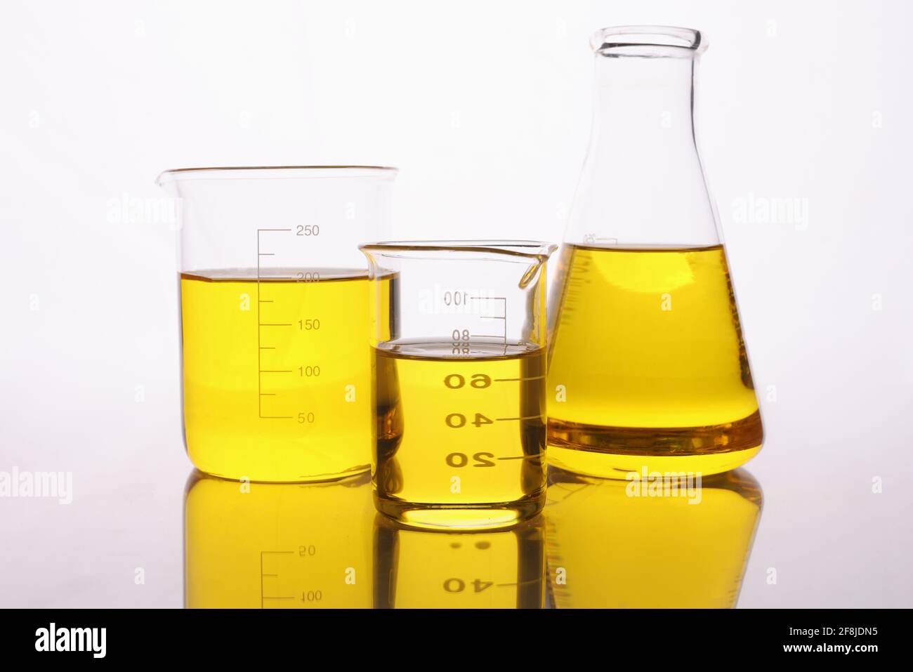 Chemical test tubes and flasks with yellow oil Stock Photo - Alamy