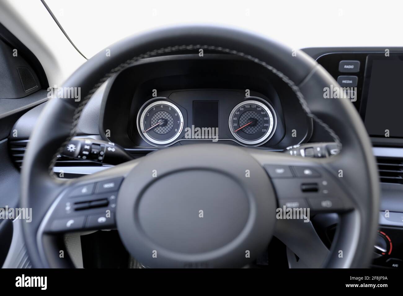 Speedometer rev indicator and steering wheel of a car Stock Photo - Alamy