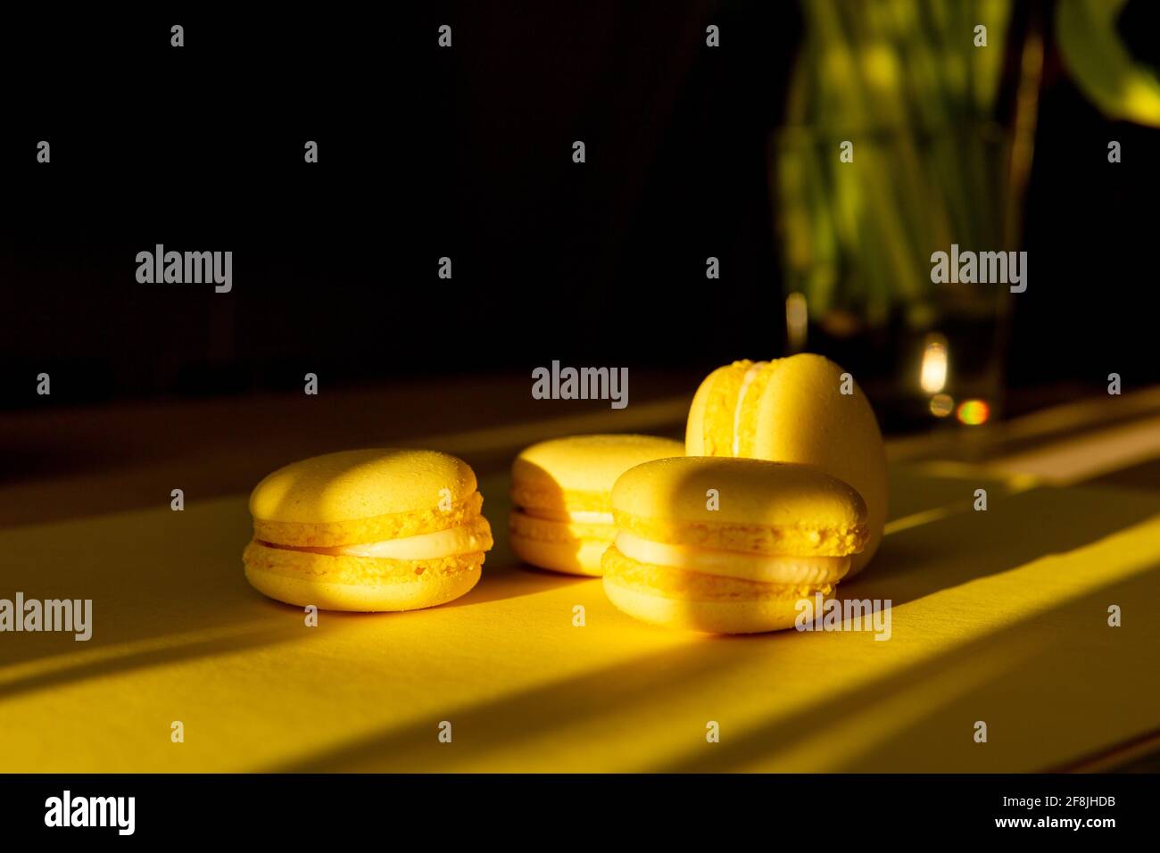 yellow macarons on a sun-filled table Stock Photo - Alamy