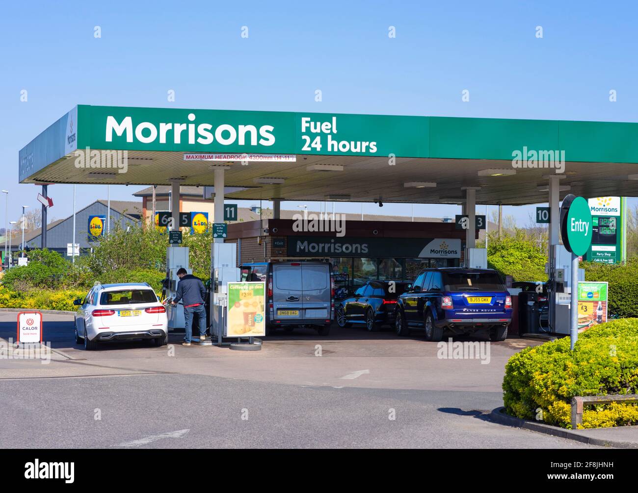 People filling cars with petrol at the Morrisons Petrol Station uk ...