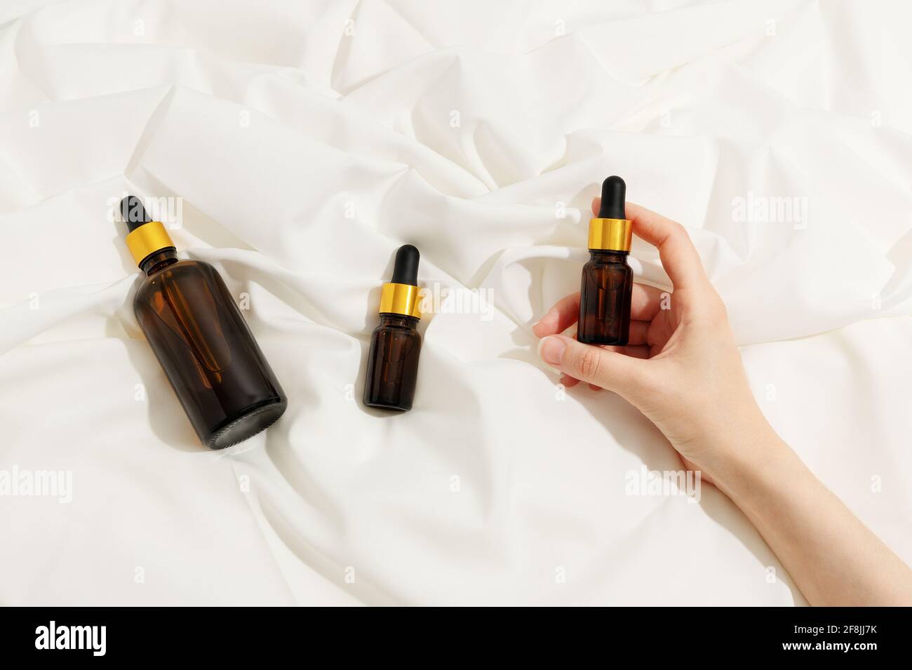 Woman essential oil bottle hi-res stock photography and images - Alamy