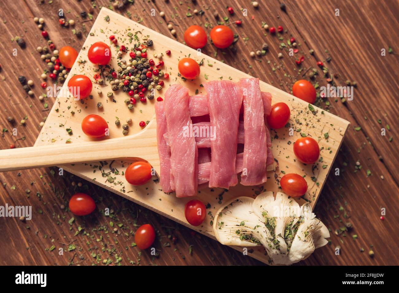 Cuts of raw steak premium on rustic wooden table. Fresh and raw meat ...