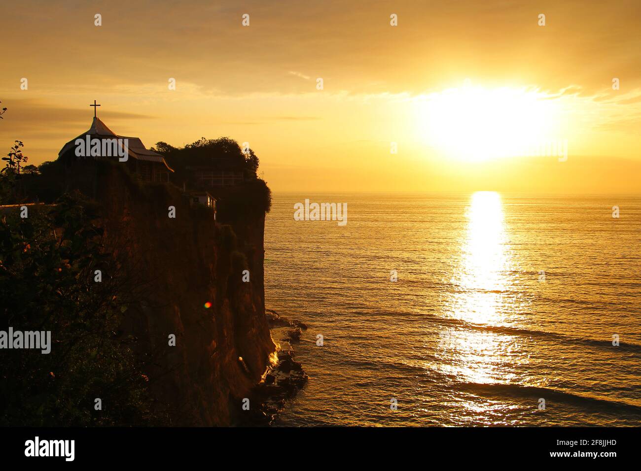 Beach Sunset with Church on Cliff Stock Photo - Alamy