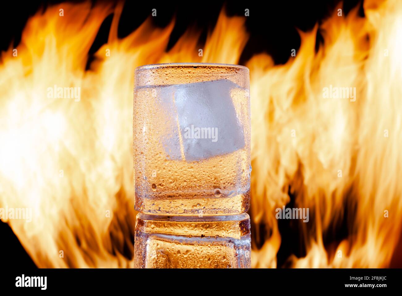 glass of vodka on a black background on fire Stock Photo - Alamy