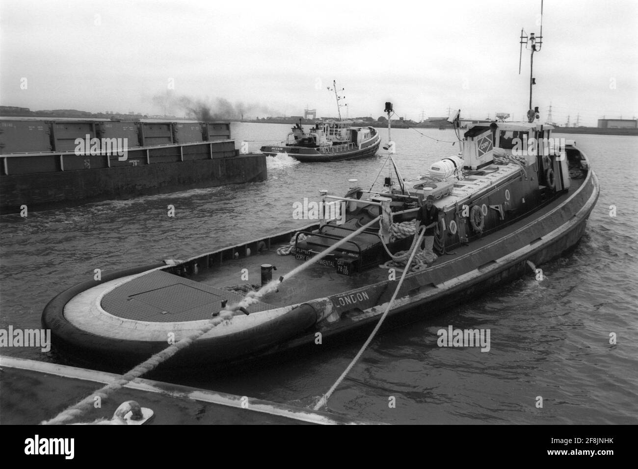 Lightermen of the River Thames towing the barges along the river Stock ...