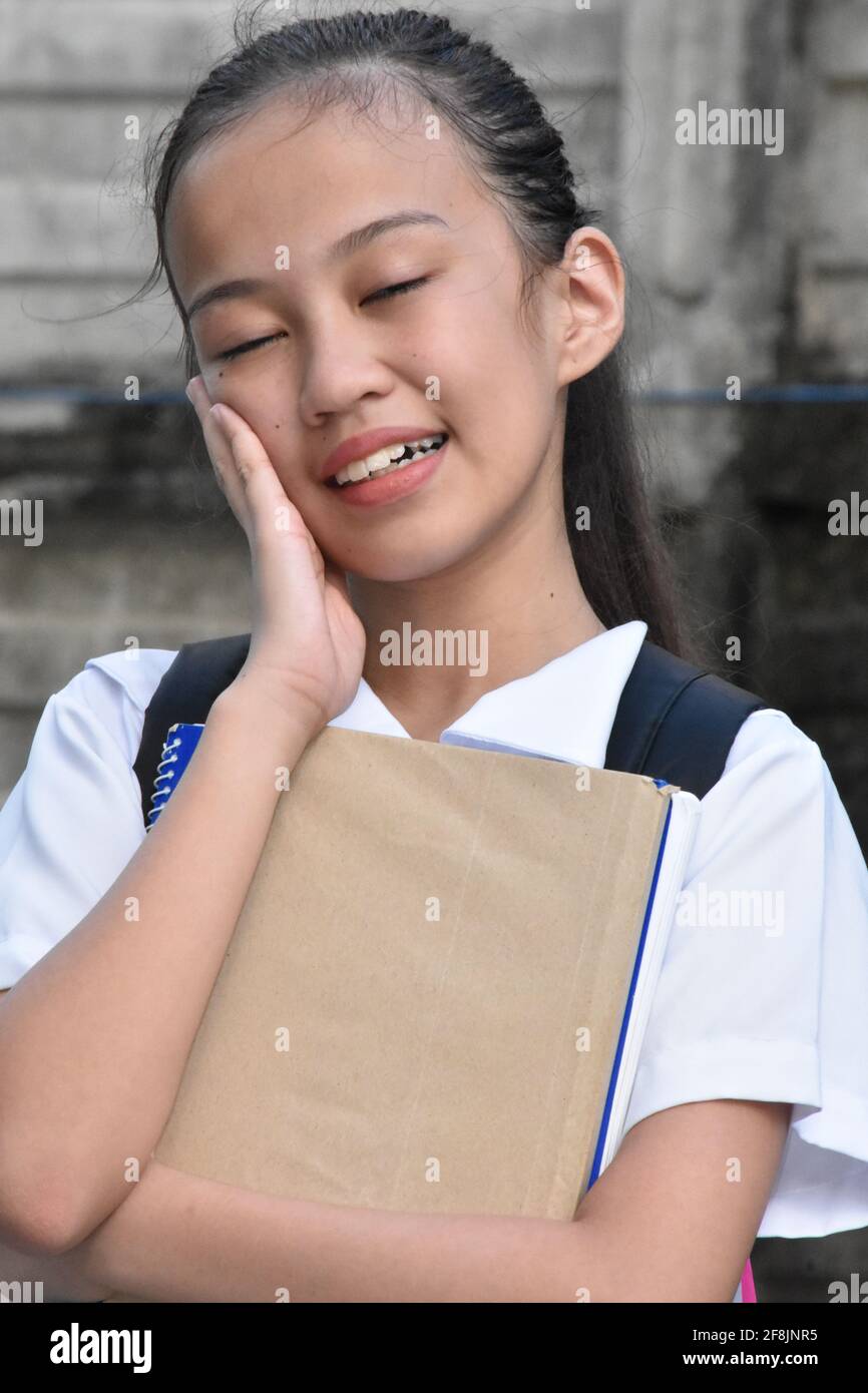 Tired Young School Girl With Notebooks Stock Photo - Alamy