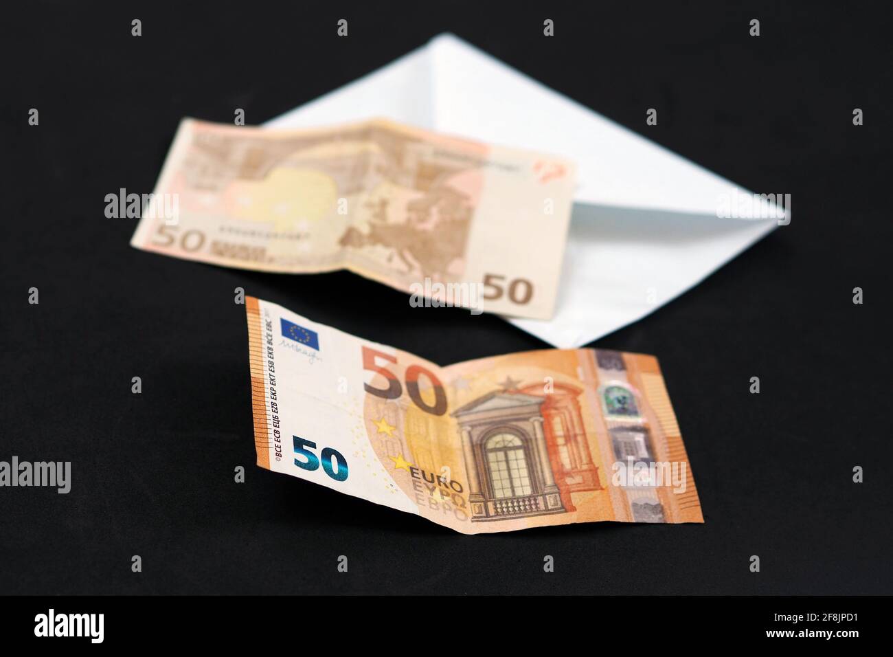 new and old 50 euro banknotes stand on black background Stock Photo - Alamy
